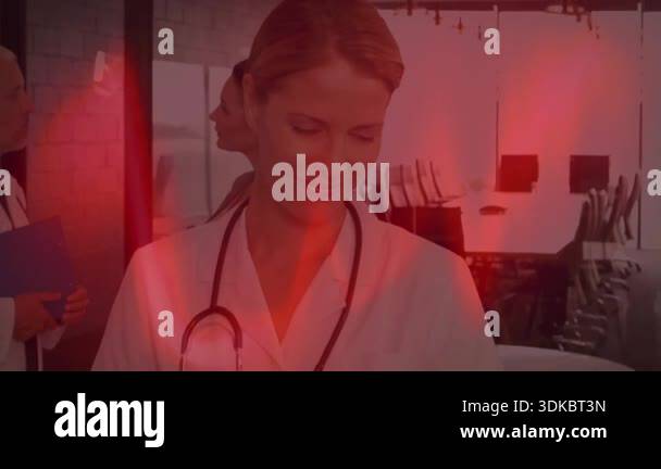 Doctor tracking pulsing red ECG waveform making eye contact as ...