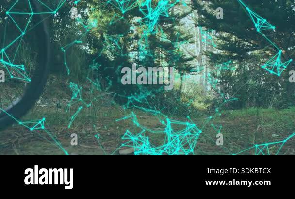 Cyclist rolling mountain bike into turquoise polygon tech overlay and ...