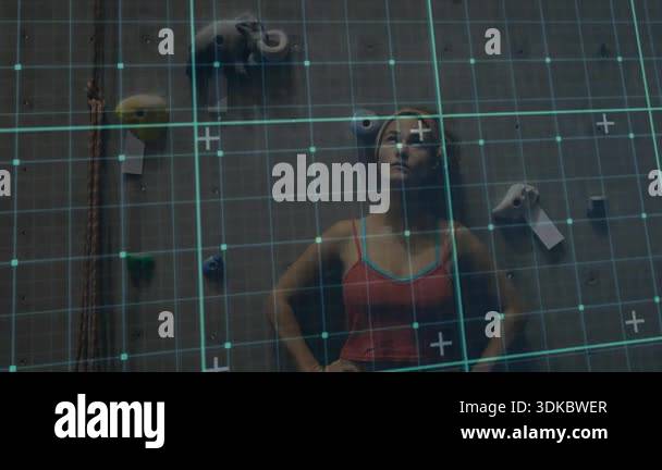 woman at climbing wall base watching flickering AR fitness grid ...