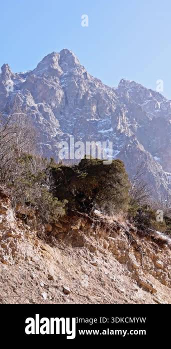 Vast mountain landscape features rocky terrain and sparse vegetation ...