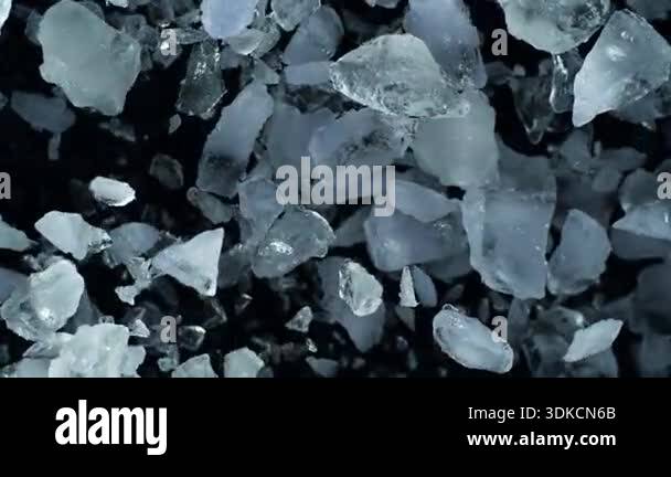 Super Slow Motion Shot of Real Ice Exploding Towards Camera on Black ...