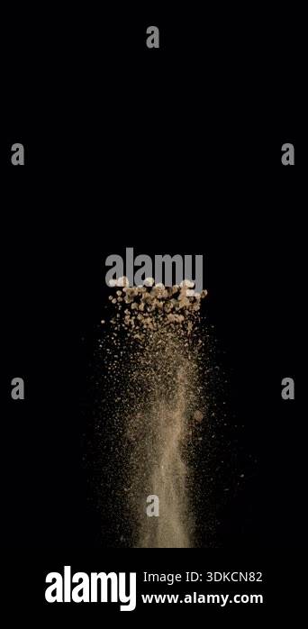 Super Slow Motion Shot Flying Soil, Rocks and Dust Isolated on Black at ...