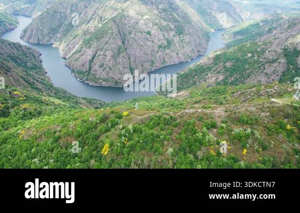 Aerial view of deep river canyon curve with green cliffs The Concept of ...