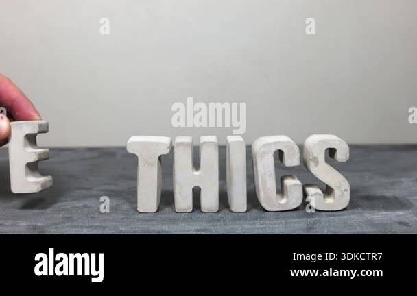 Human Hand Places Letter E Completing ETHICS Word Using Concrete ...