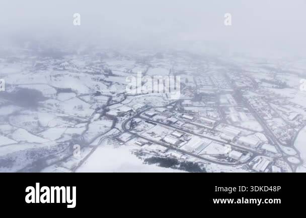 Drone shot of frozen countryside houses and roads The Concept of Cold ...