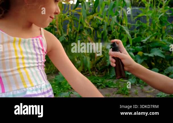 Child spraying mosquito repellent. Selective focus. Kid Stock Video ...