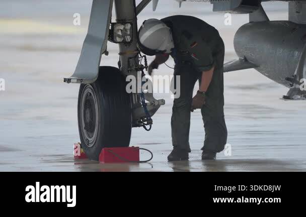LUQA, MALTA - SEPTEMBER 28, 2025: A member of the ground crew inspects ...