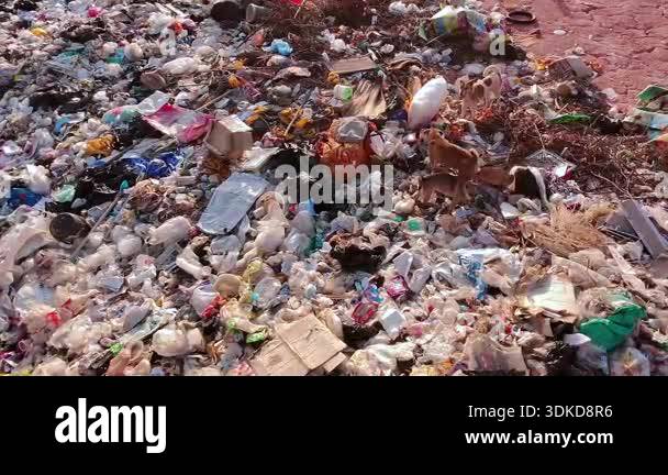 massive landfill filled with plastic waste and garbage, showing severe ...