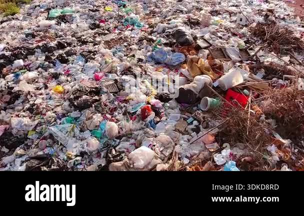 massive landfill filled with plastic waste and garbage, showing severe ...