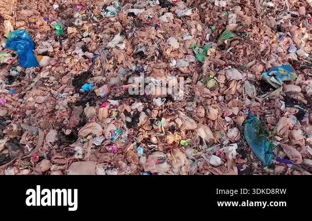 massive landfill filled with plastic waste and garbage, showing severe ...