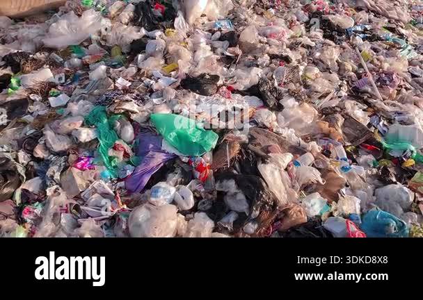 massive landfill filled with plastic waste and garbage, showing severe ...