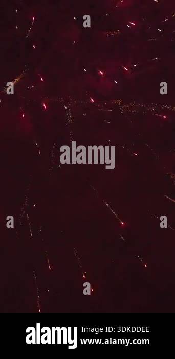 This vertical video clip shows a spectacular close-up of a firework ...