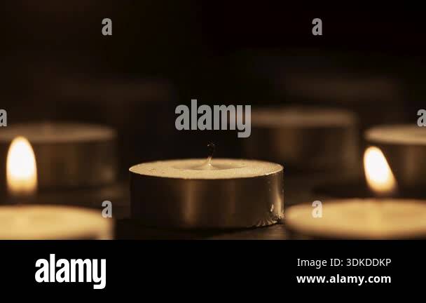 Many burning candles in the dark. Memorial day. Funeral candles. close ...