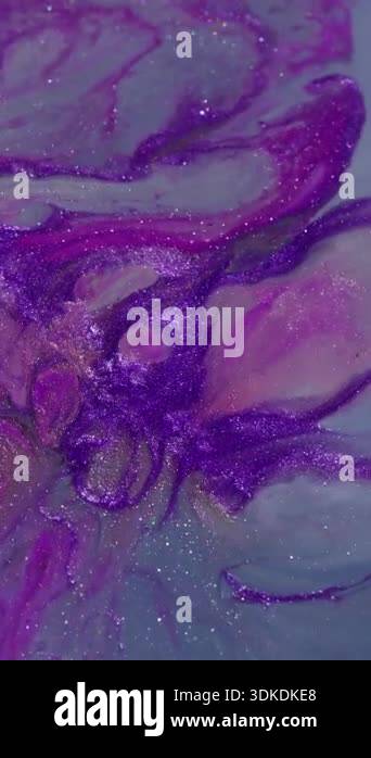 Vertical video. Sparkling wave. Liquid texture. Defocused purple blue ...