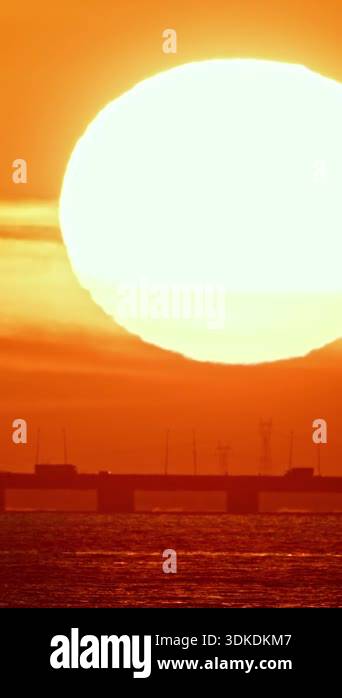Vehicles crossing a bridge during a vibrant sunset Stock Video Footage ...
