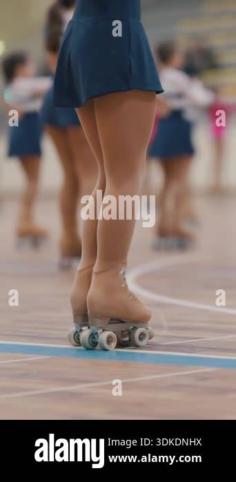Young girl on roller skates performing a choreographed artistic skating ...