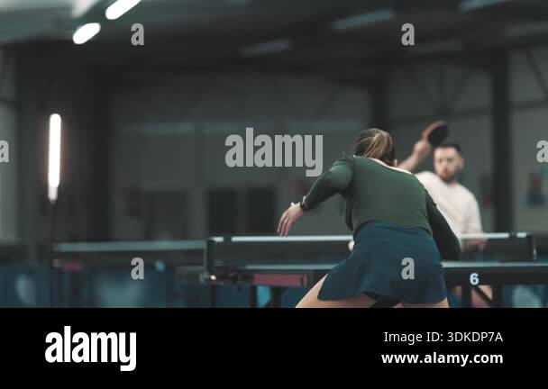 Female ping pong player celebrating winning a point during an intense ...