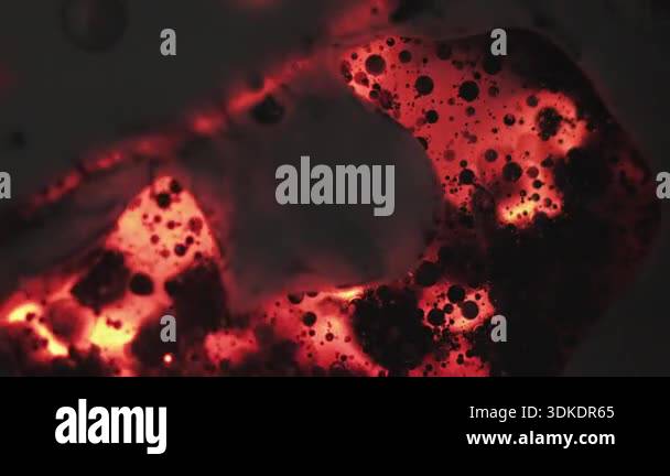 Volcanic background. Spill ink texture. Defocused dark pink neon water ...