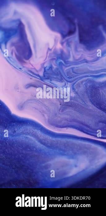 Vertical video. Sparkling ink. Ripple texture. Defocused blue pink ...