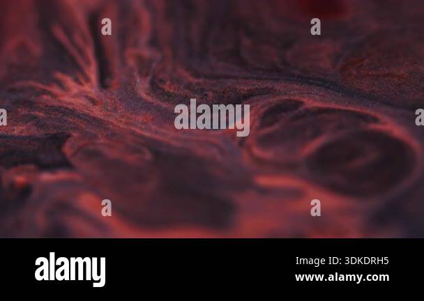 Paint wave. Glitter mix. Defocused orange purple color in water grain ...