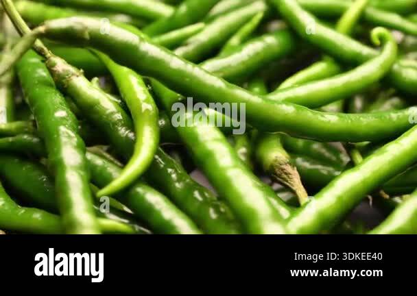 Rotate Clip Of Fresh Organic Green Chili Peppers Spicy Vibrant Food ...