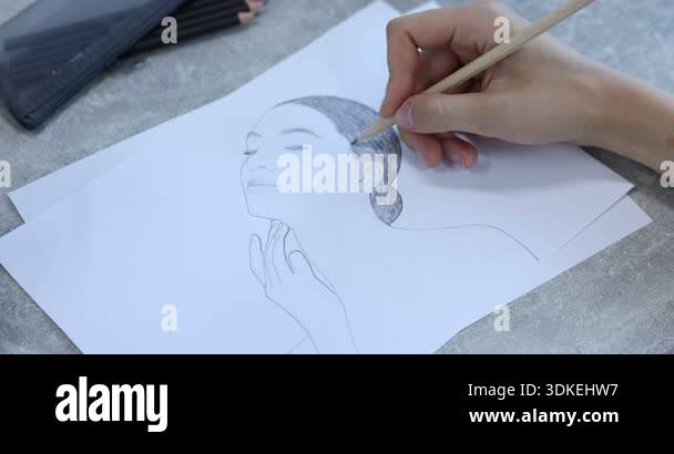 Woman drawing portrait sketch at grey table, closeup Stock Video ...