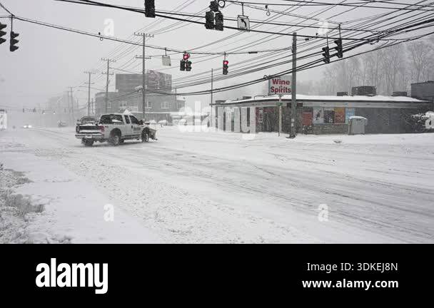 NORWALK, CT, USA -JANUARY 25, 2026: Snow plow truck drive during a ...