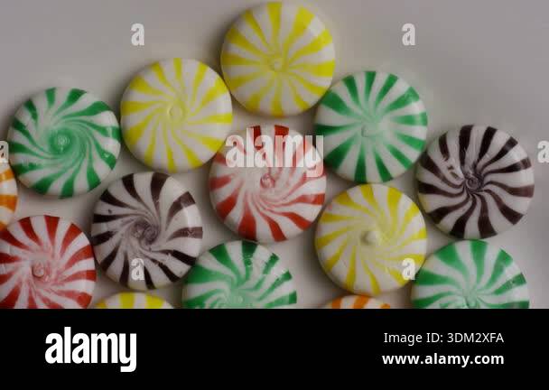Top down view of colorful peppermint candy swirls in various colors ...