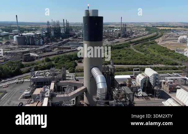 Aerial view of huge power plant with chimney stacks, cooling towers and ...
