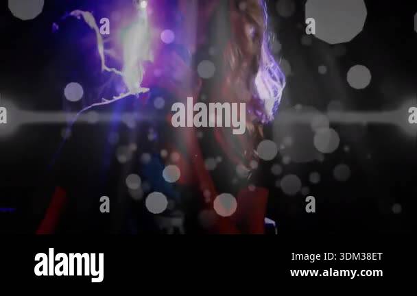 Female singer raising mic and performing music with flares and ...
