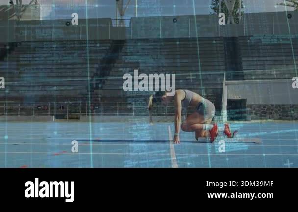 Female athlete placing hands on track blocks for sprint training ...