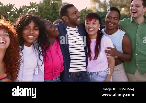 Young multicultural group of happy friends having fun together outdoors ...