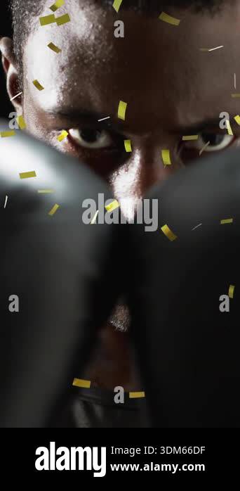 Animation of confetti falling over african american male boxer on black ...