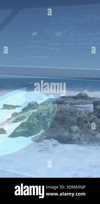 Digital interface animation over ocean waves crashing on rocky shore ...