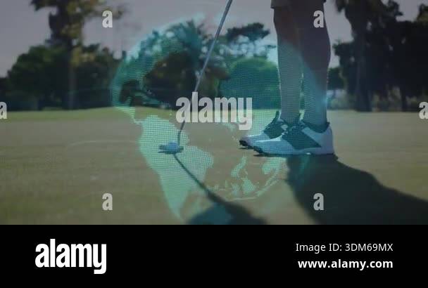 Golfer lining up ball on putting green and starting translucent globe ...