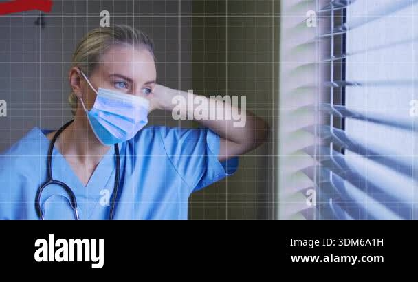 Medical nurse observing red line chart appearing on grid while closing ...