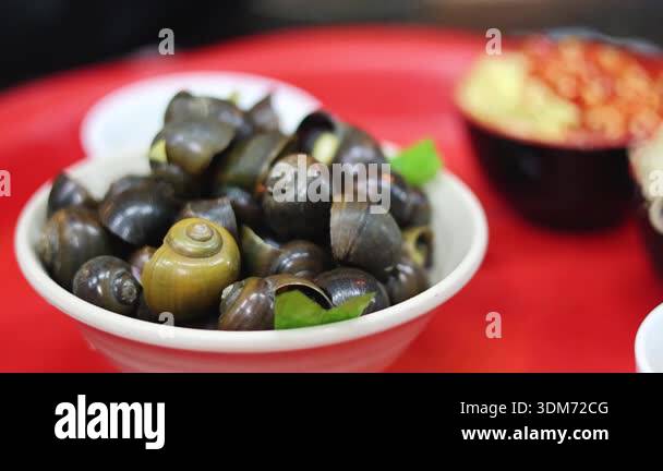 Sequential display of snail dishes being served Stock Video Footage - Alamy