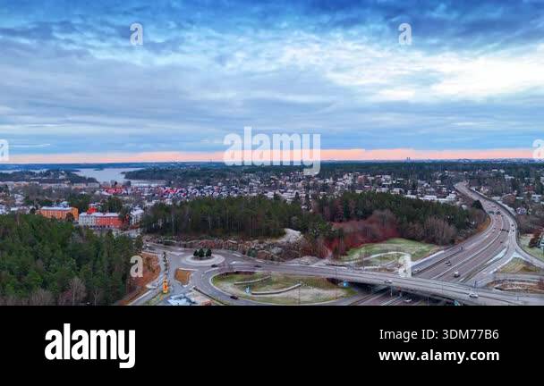 Scenic view of a city with roads and water during the evening light ...