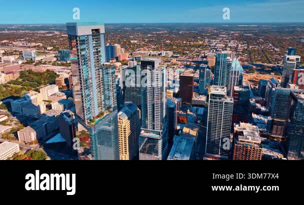 Modern glass high-rise buildings in city center. Low-rise urban ...