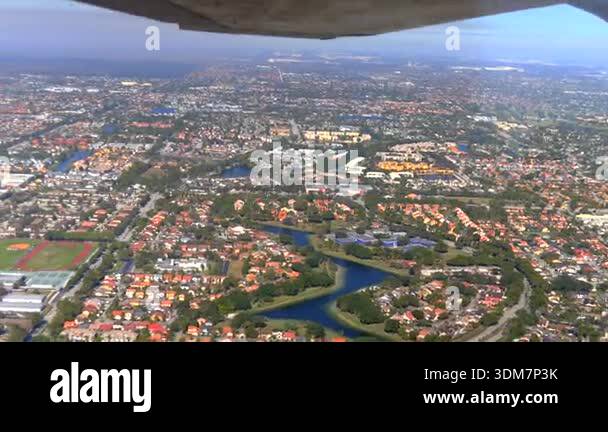 Aerial view of Miami suburbs with houses and river from private ...
