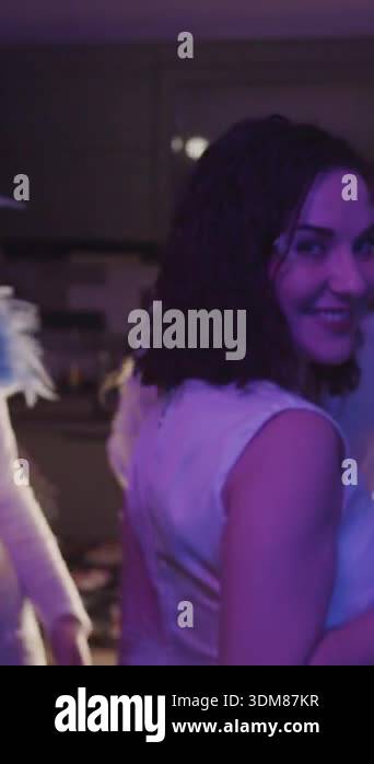 Beautiful adult women in fancy carnival outfits having a party and ...