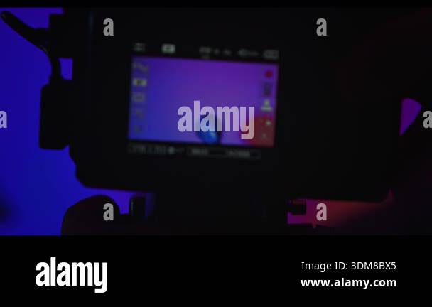 The cameraman sets up the camera, which captures a mannequin and a ...
