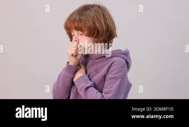 Little boy coughing on light background. Cold symptom Stock Video ...