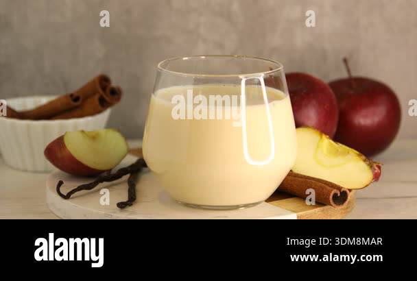 Sprinkling cinnamon onto delicious protein shake, vanilla pods and ...