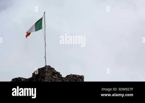 An Irish flag is flying above castle in Ireland Stock Video Footage - Alamy