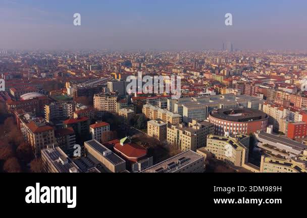 Panoramic aerial view flying over the urban landscape of milan, italy ...