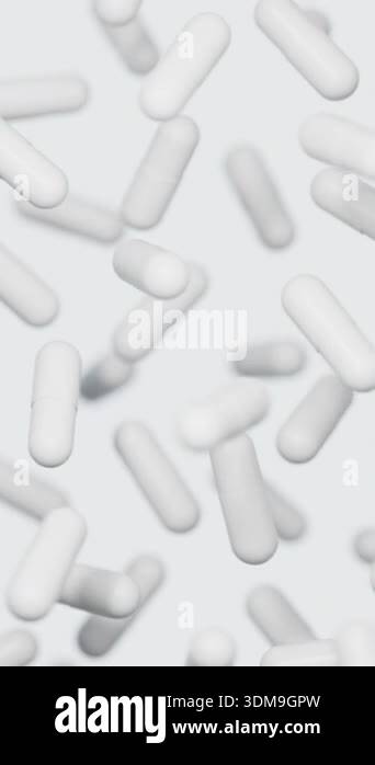 Animation of white medicine capsules rotating against white backdrop ...
