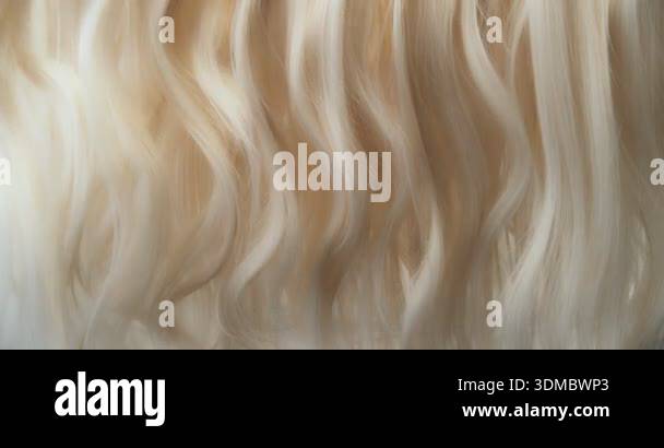 Ultra slow motion shot of blonde hair flowing in smooth, elegant waves ...
