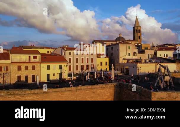 Explore Alghero, Sardinia from above, capturing its stunning historic ...