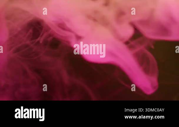Fluorescent steam. Ink fog. Blur yellow pink color vapor splash water ...